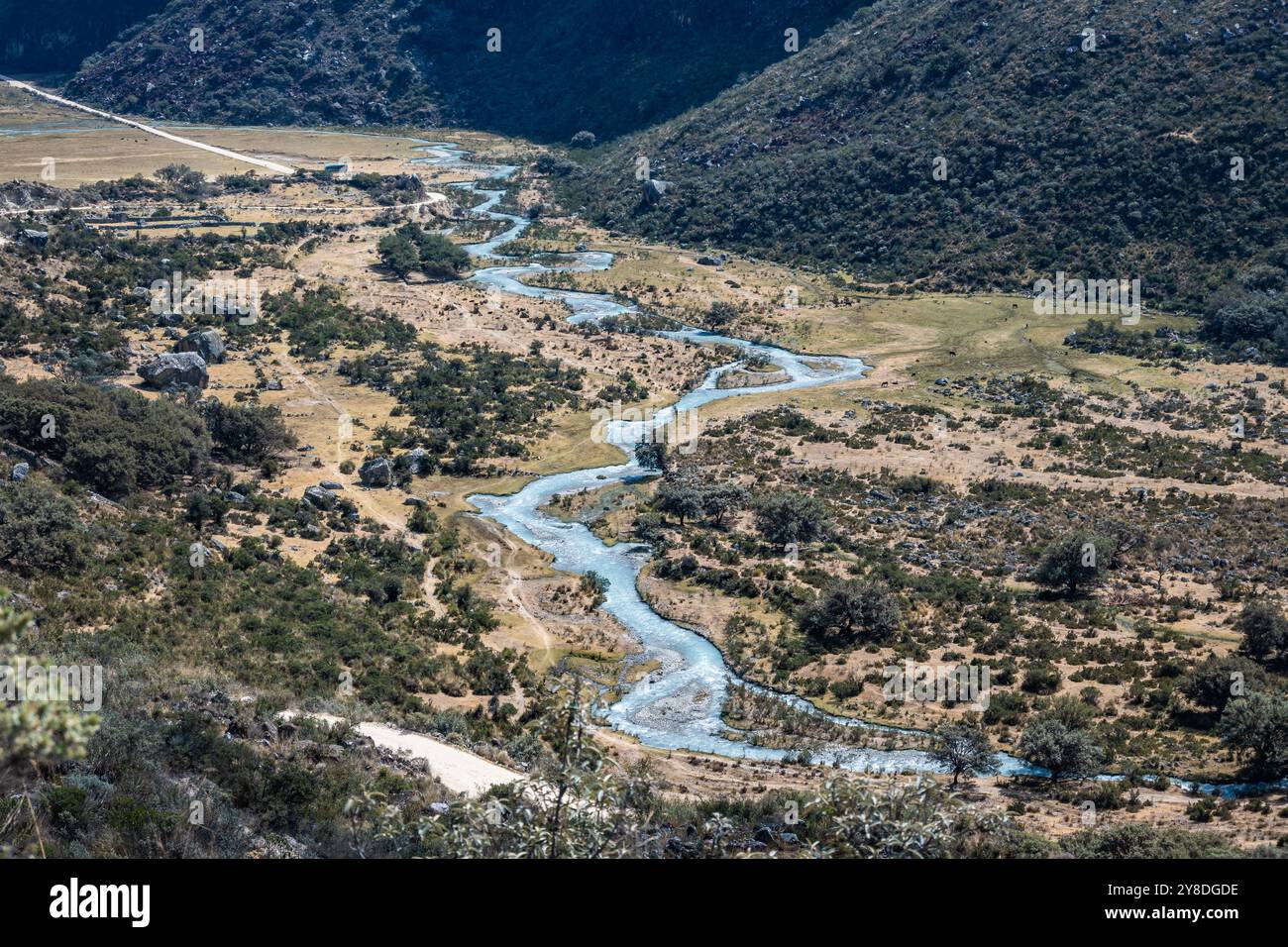 Glacier fed milky blue river running down the Andes mountains. Peru ...