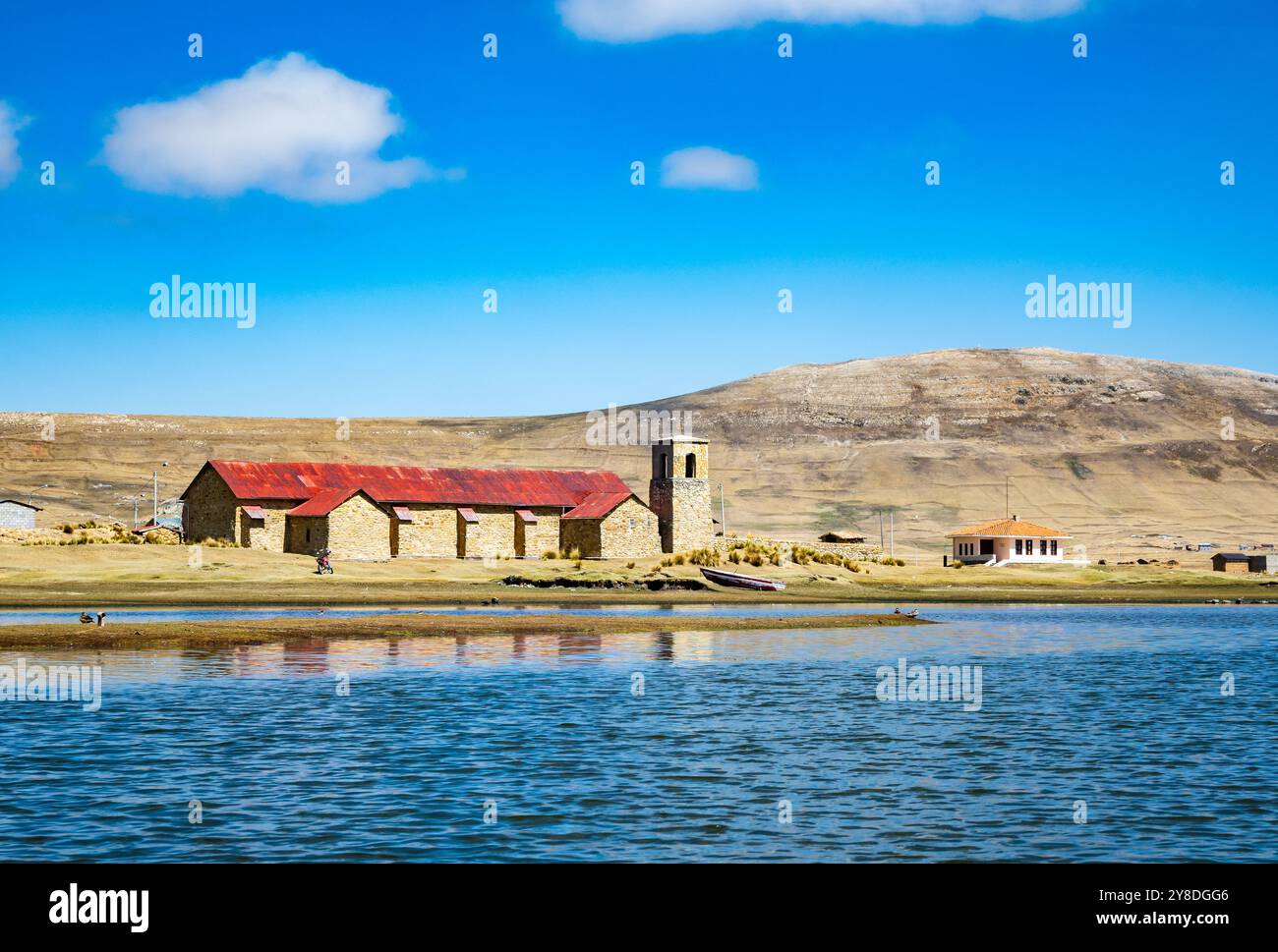 Historic stone church Iglesia St Pedro De Pari standing by the shore of ...