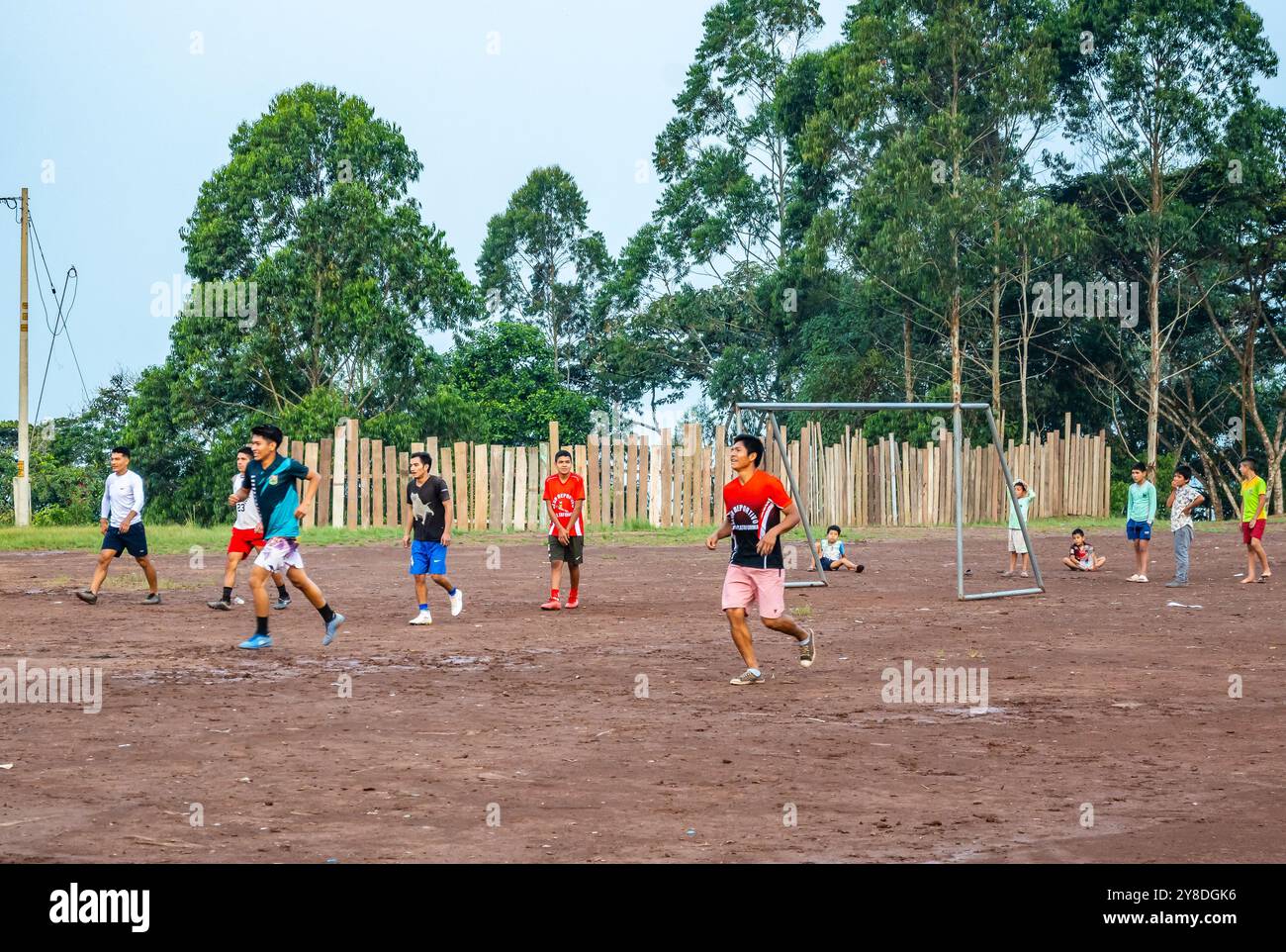A group of young men playing football in a remote village. Peru, South ...