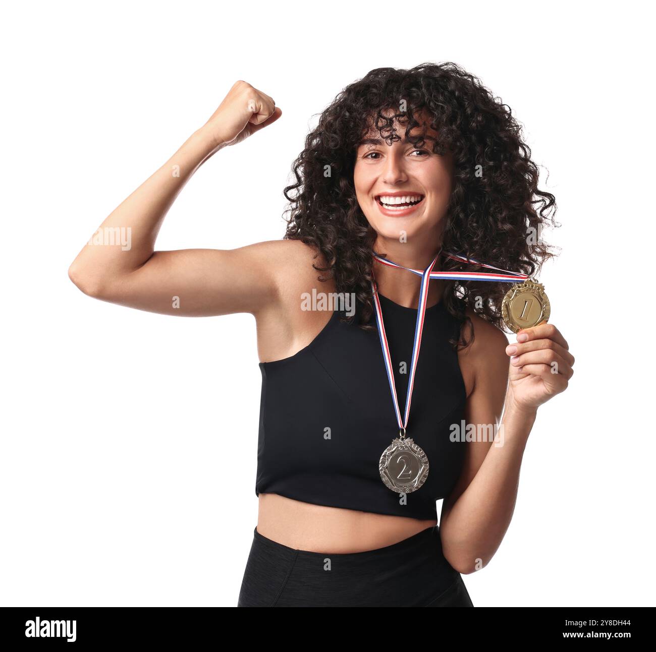 Happy winner with different medals showing muscles on white background ...