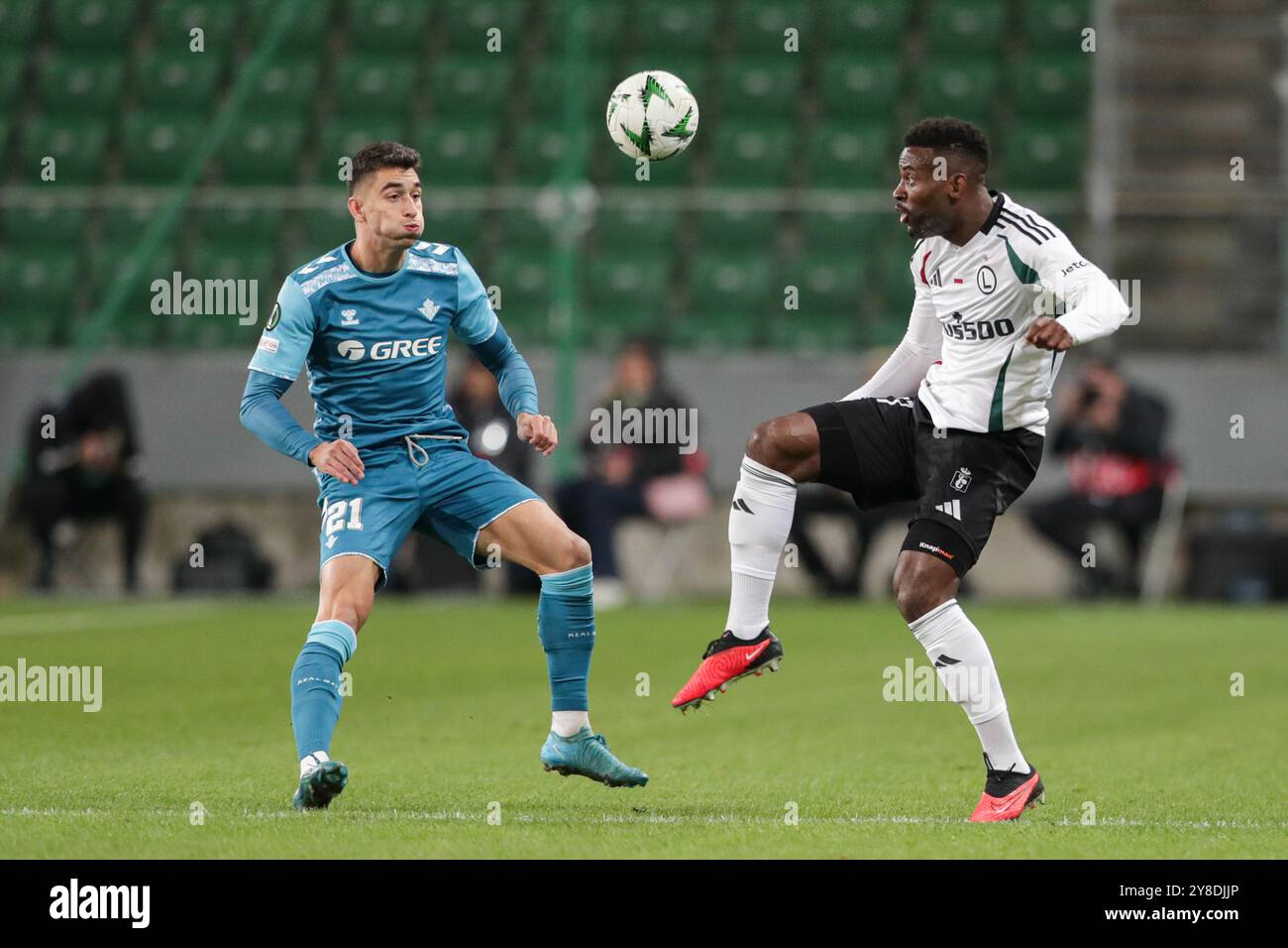 Marc Roca of Real Betis Balompie (L) and Jean-Pierre Nsame of Legia ...