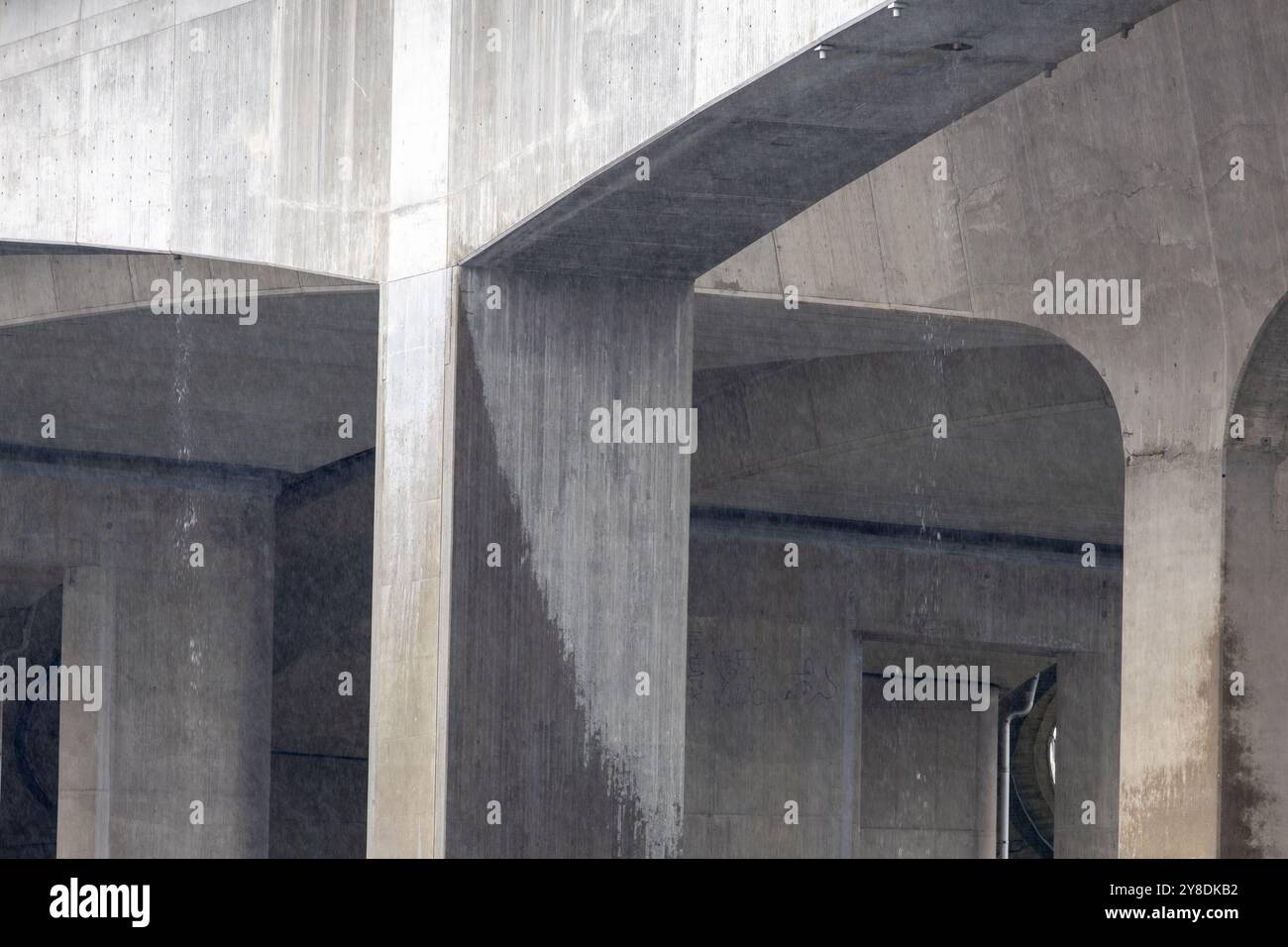 Close-up view of a modern concrete bridge structure with geometric ...