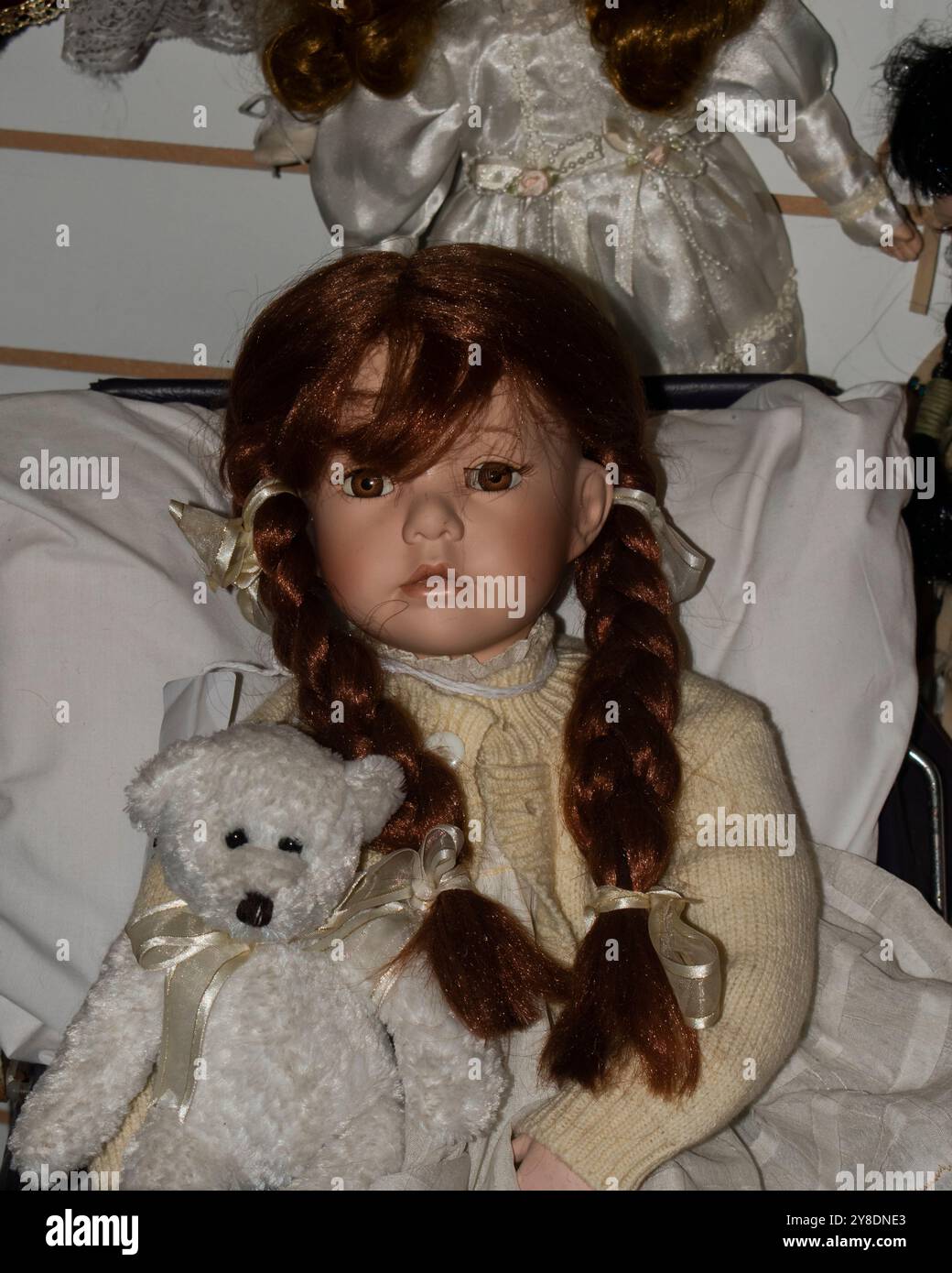 Cute pretty girl doll with brown pigtails and white teddy bear ...