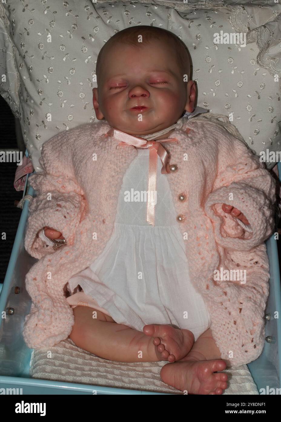 Cute reborn baby doll sleeping in bed on a large white pillow, asleep ...