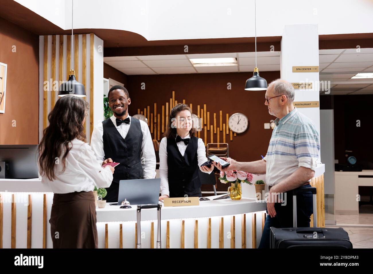 Elderly couple receives assistance from friendly employees at hotel ...