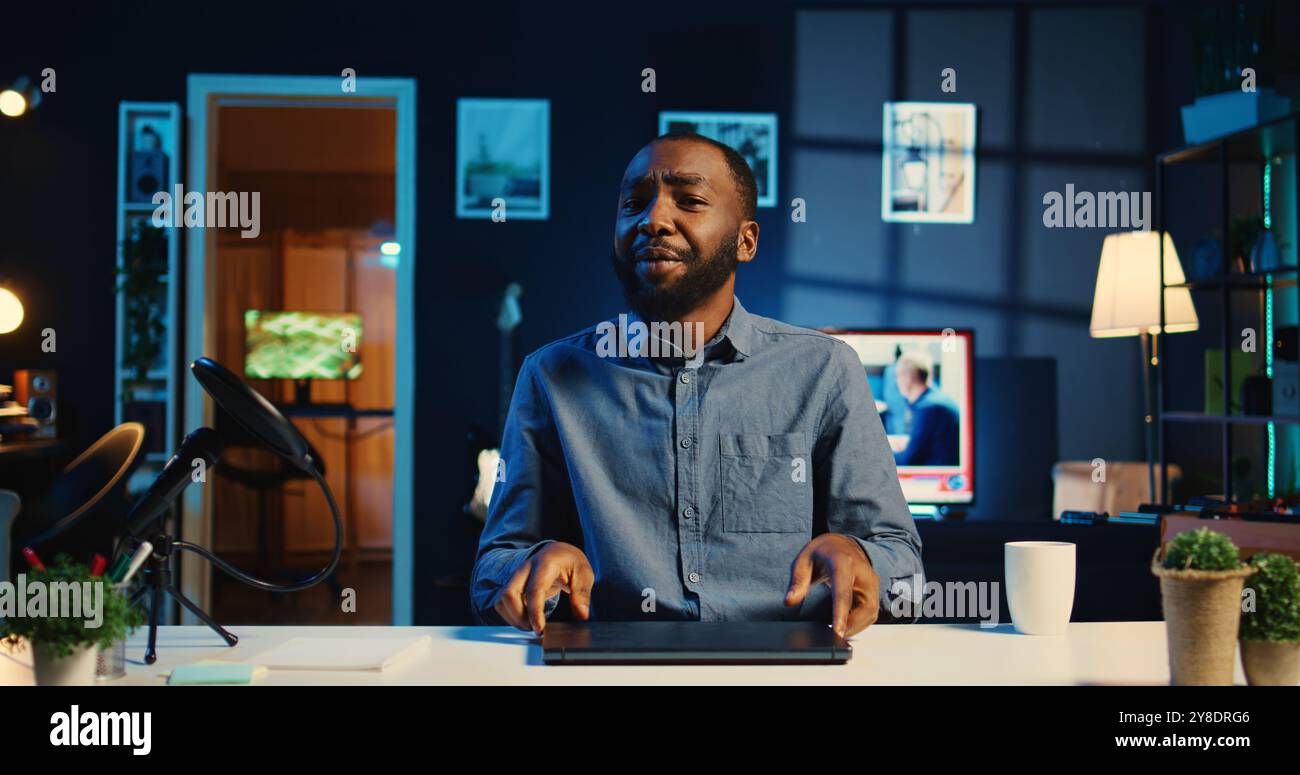 African american content creator filming technology review of newly ...