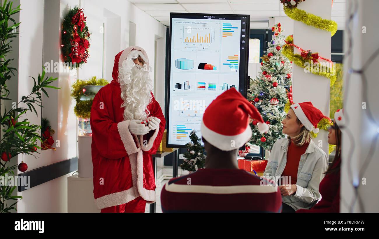 Certified presenter dressed as Santa Claus doing presentation in front ...