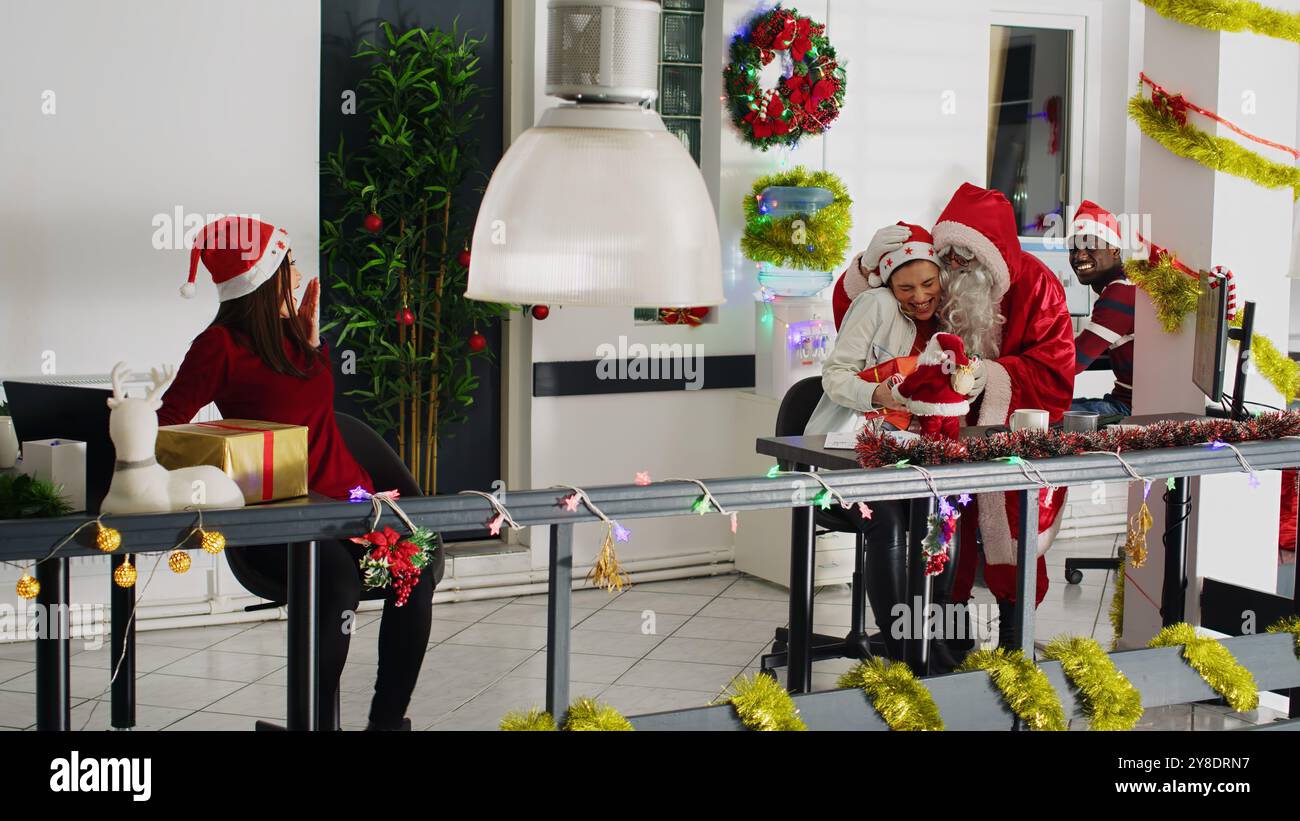 Manager dressed as Santa Claus spreading holiday joy in xmas ornate ...