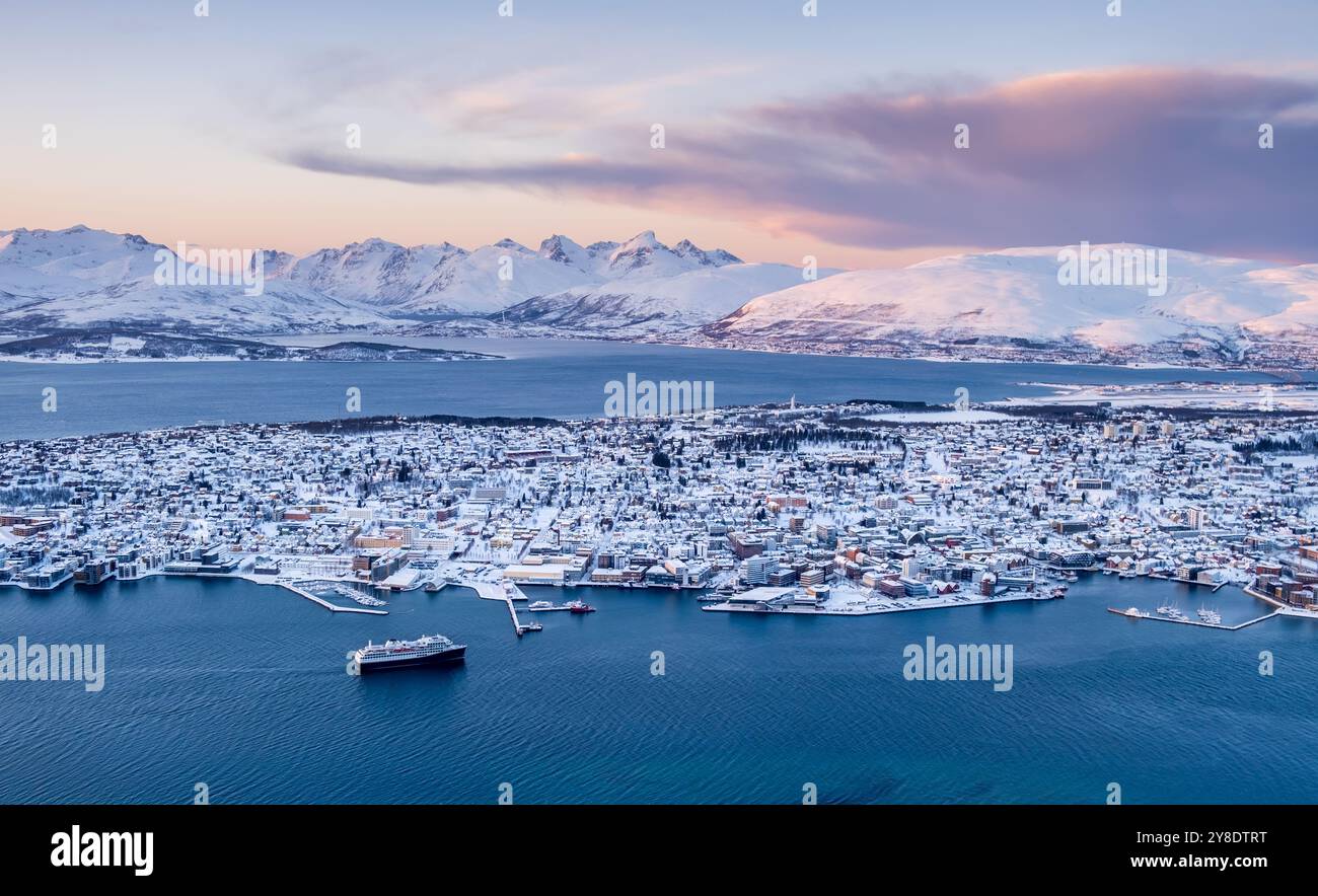 Aerial view of Tromso, Norway at sunset in winter from Storsteinen ...