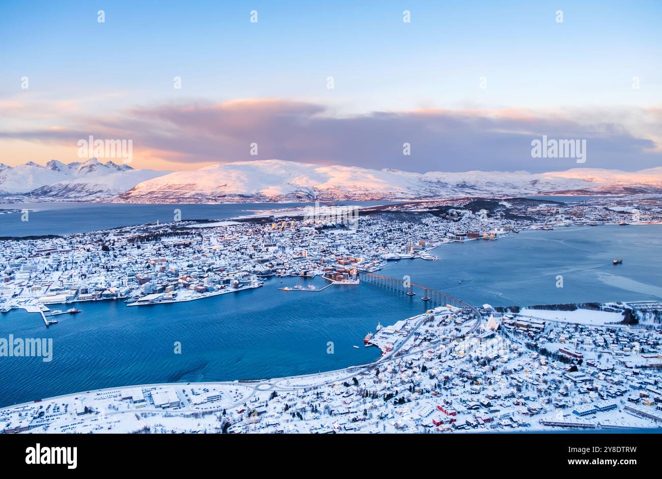 Aerial view of Tromso, Norway at sunset in winter from Storsteinen ...