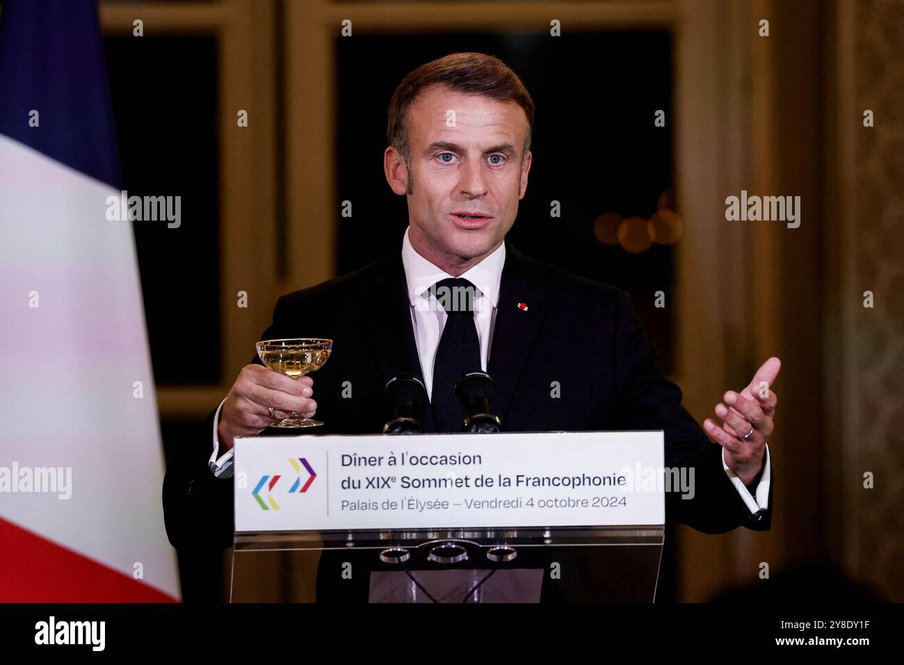 French President Emmanuel Macron speaks during a gala dinner at the ...
