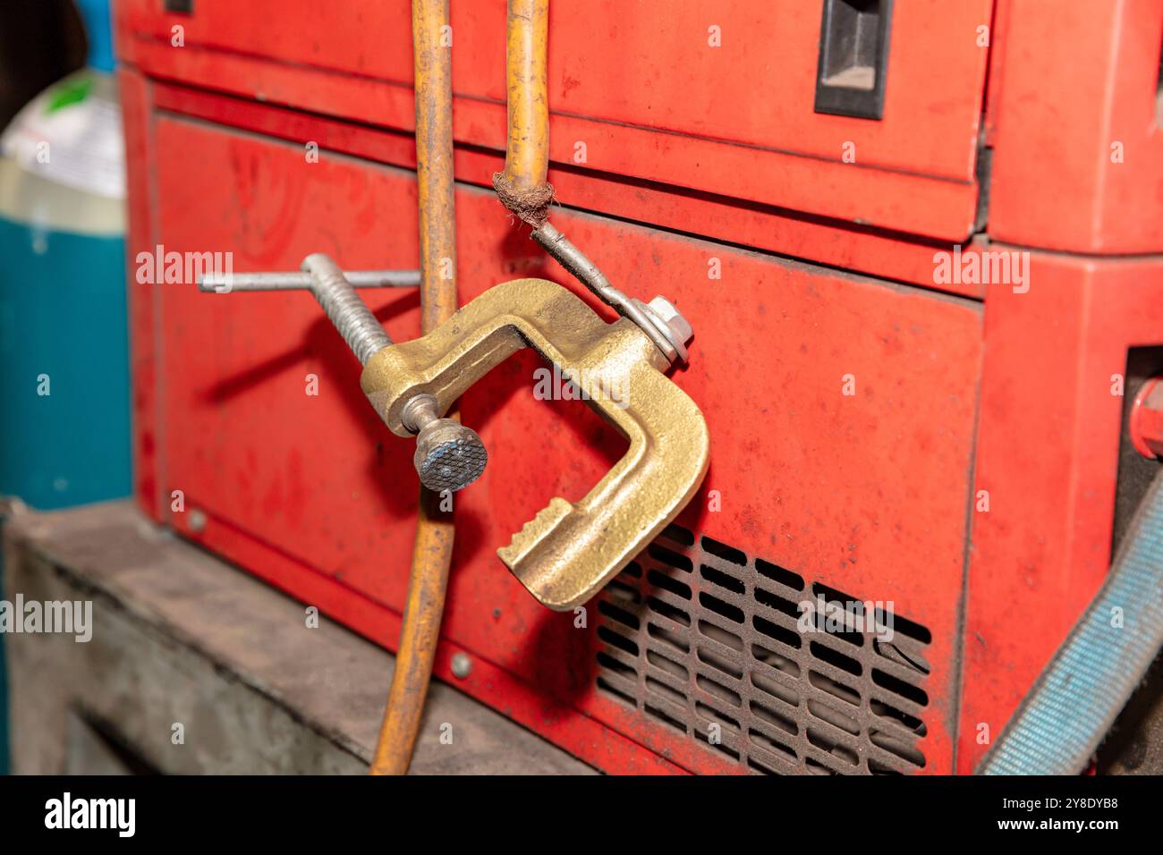 Photograph of an old and damaged earth clamp and cable on a welding ...