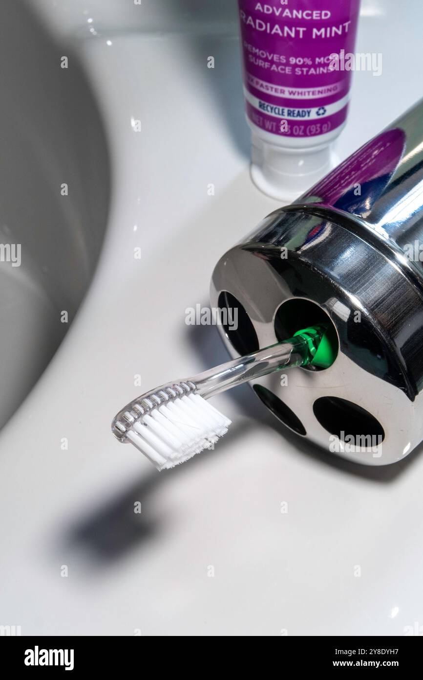 Close up of Oral -B Toothbrush and Crest Toothpaste on aBathroom Sink ...
