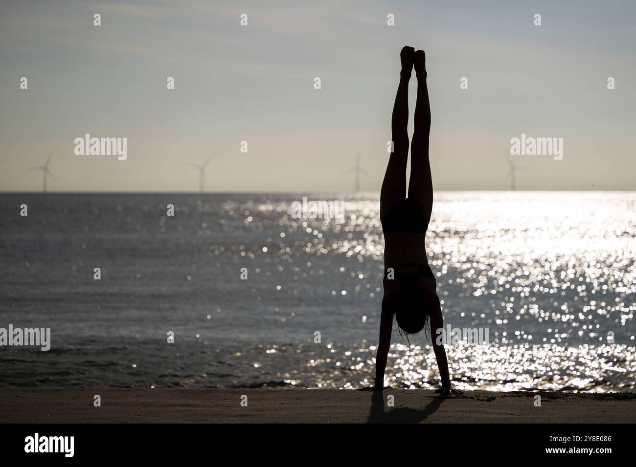 Girl doing a handstand by the sea, Silhouette, Sondervig Strand, North ...