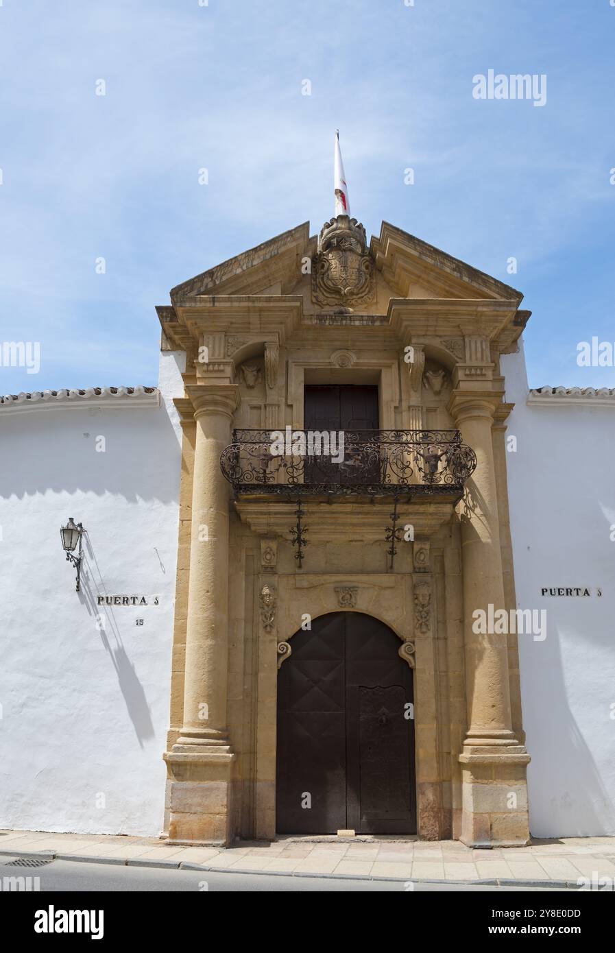 Historic stone entrance gate with decorated coat of arms and balcony in ...