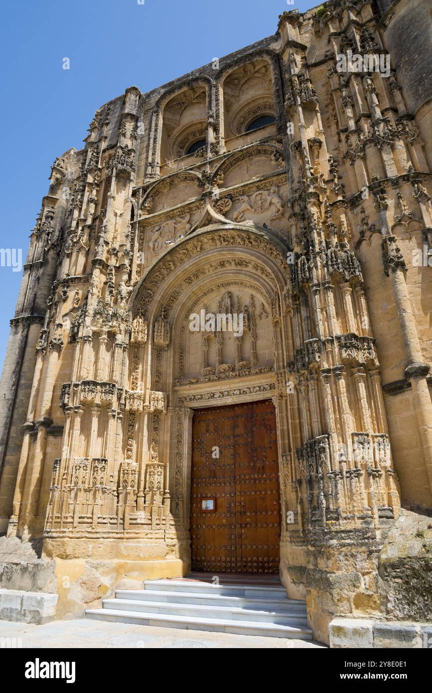 Impressive Gothic church facade with ornately carved portal and massive ...