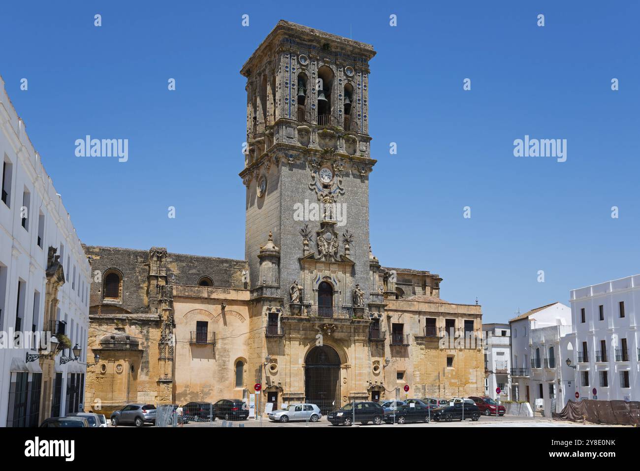 A town square with an impressive bell tower and surrounding buildings ...