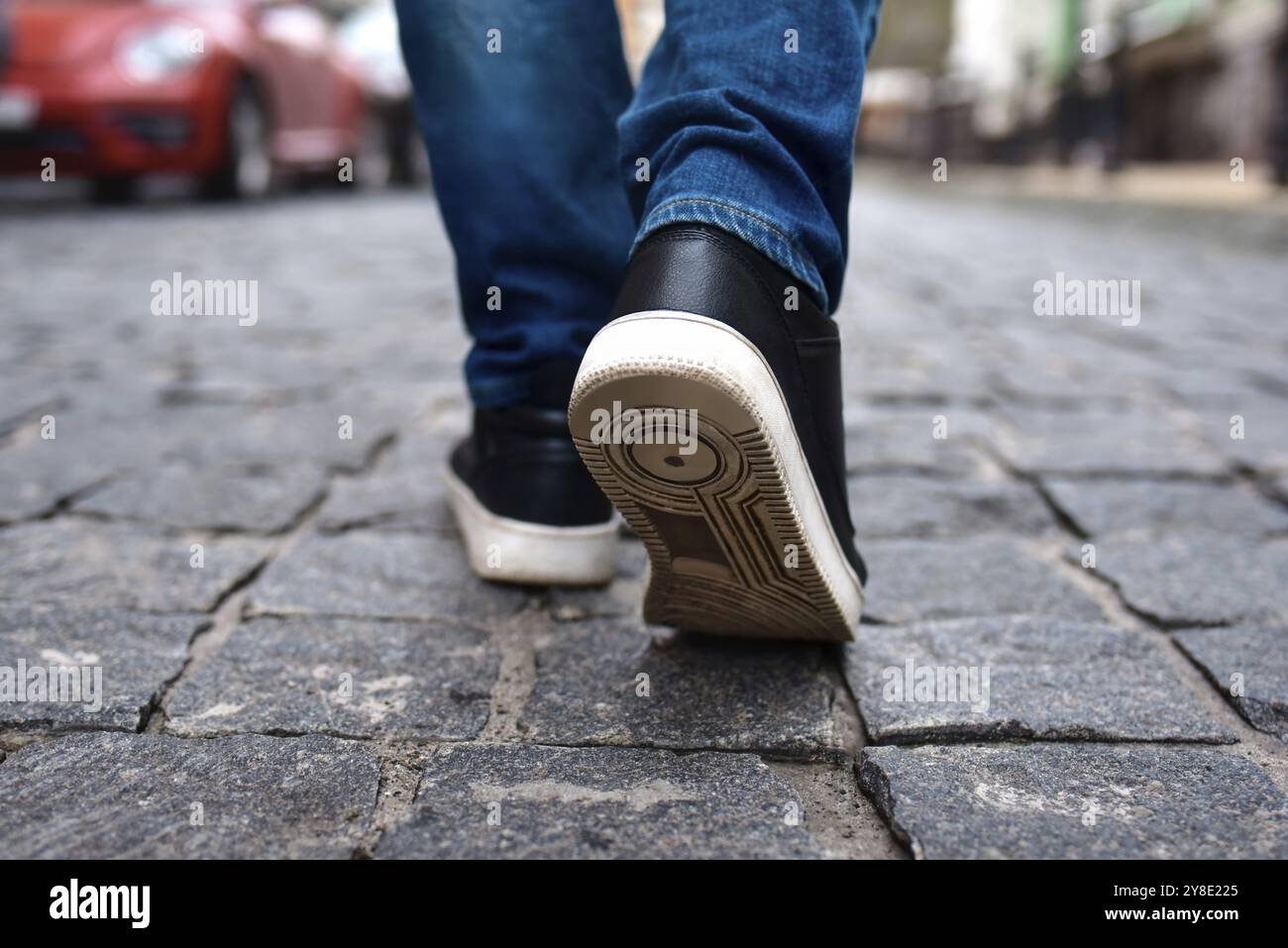 Man walking on road close hi-res stock photography and images - Alamy