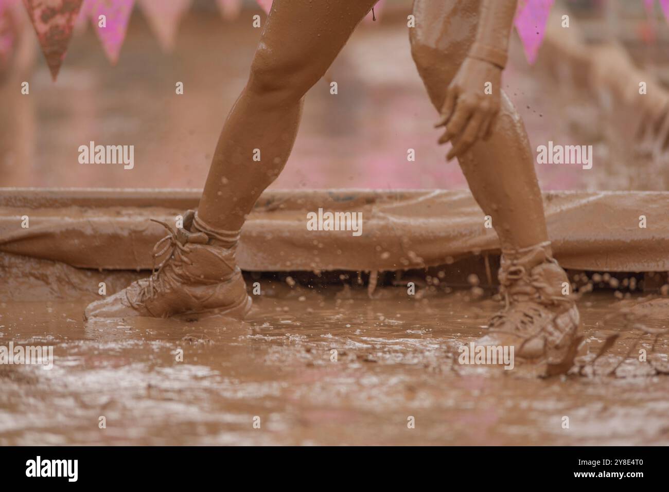 Muddy shoes and exercise at a muddy outdoor event Stock Photo - Alamy