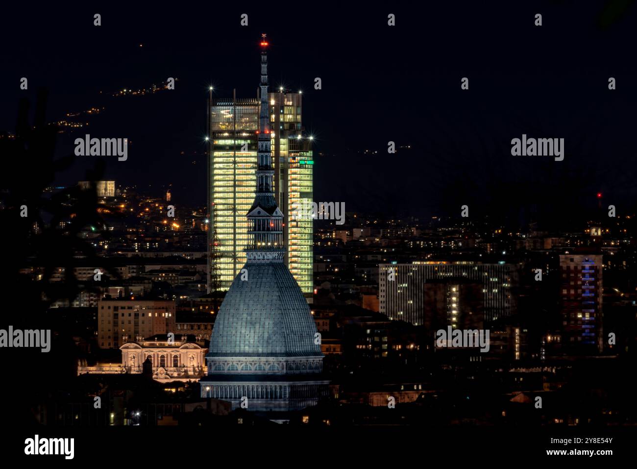 Night view of Torino with the iconic Mole Antonelliana fading the ...