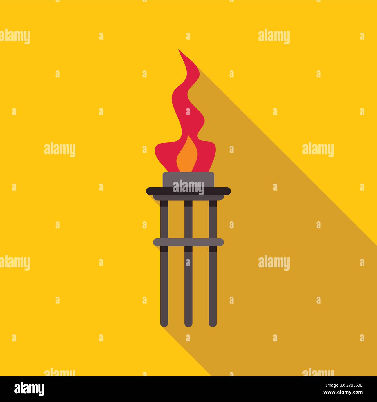 Ancient torch burning with bright flame casting long shadow on yellow ...