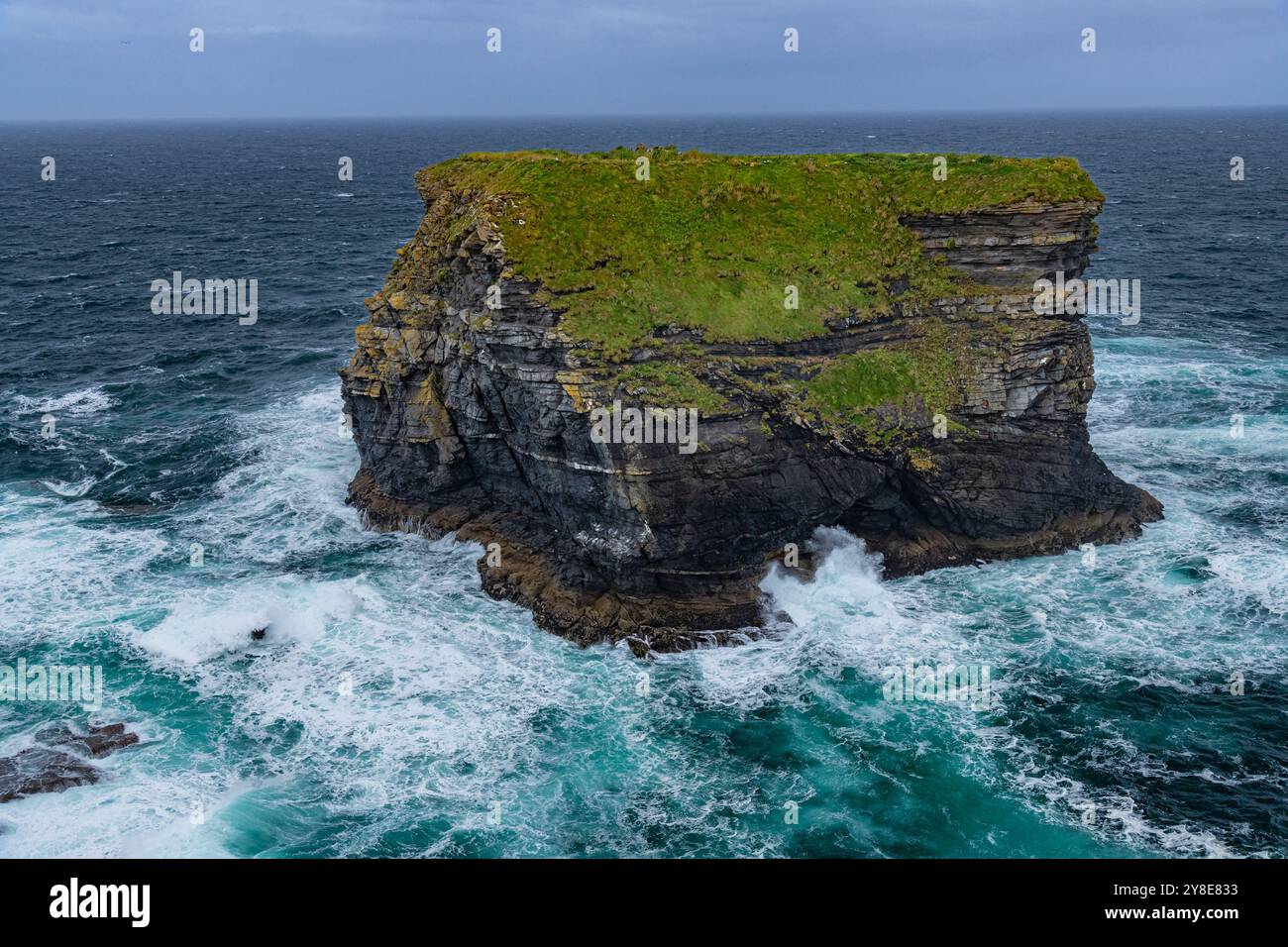 Rugged Coastal Cliffs with wild Atlantic ocean waves clashing against ...