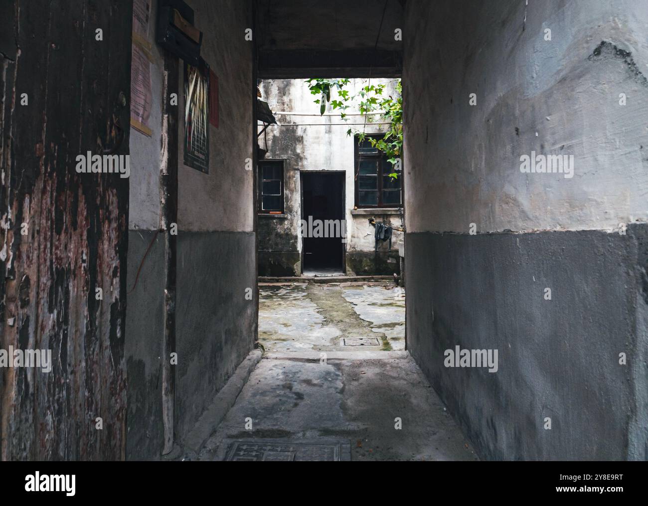 Narrow passageway leading to a secluded courtyard in an old urban ...