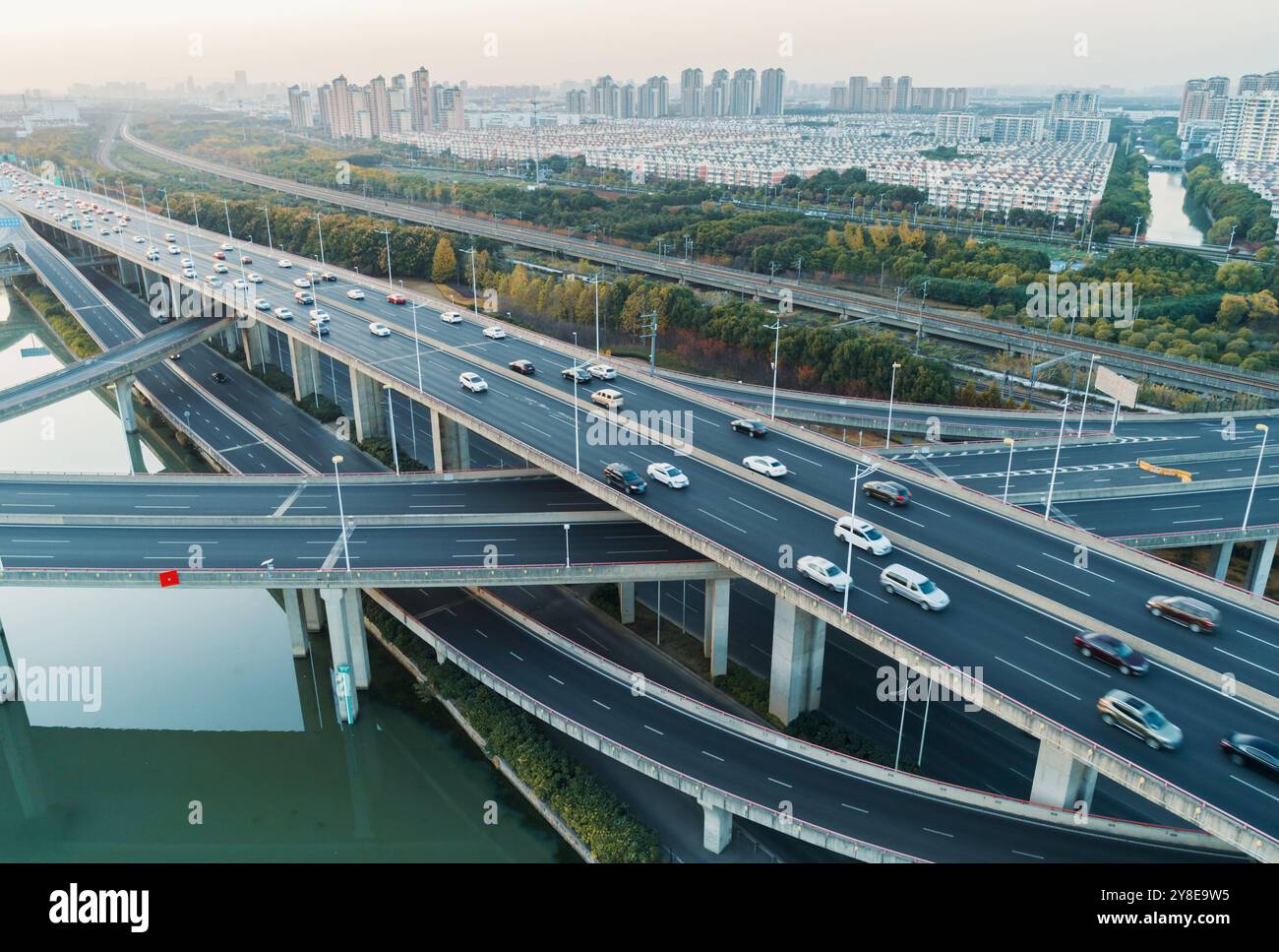 Aerial view of interconnected highways with traffic in a suburban area ...