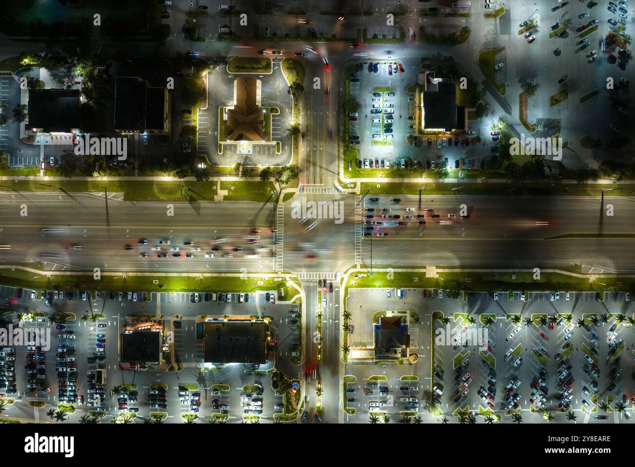 Aerial view of shopping plaza stores and American wide highway with ...