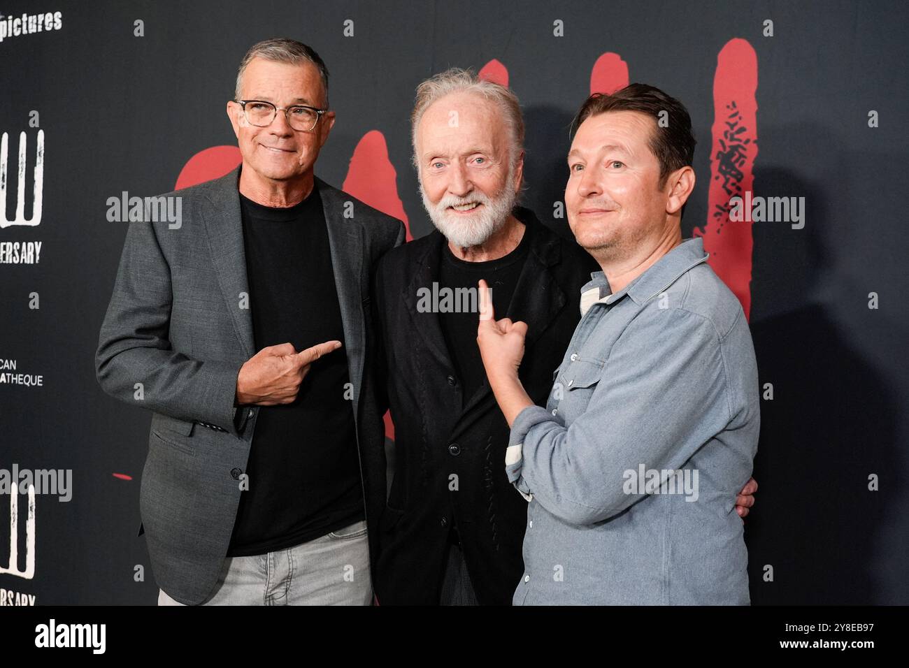 Mark Burg, from left, Tobin Bell, and Oren Koules arrive at the 20th ...