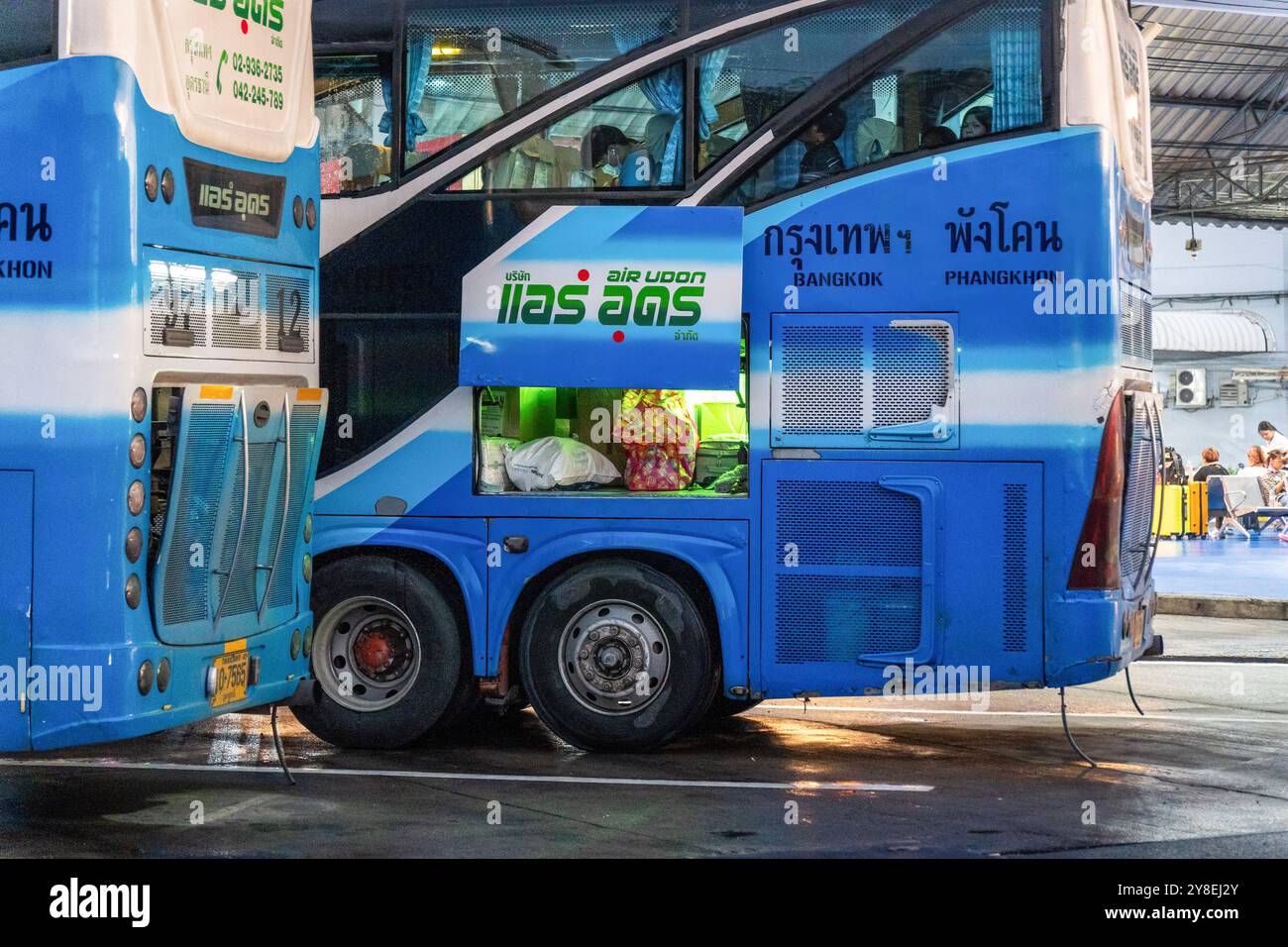 A close-up of an opened luggage hold of a double-decker bus, at Mo Chit ...