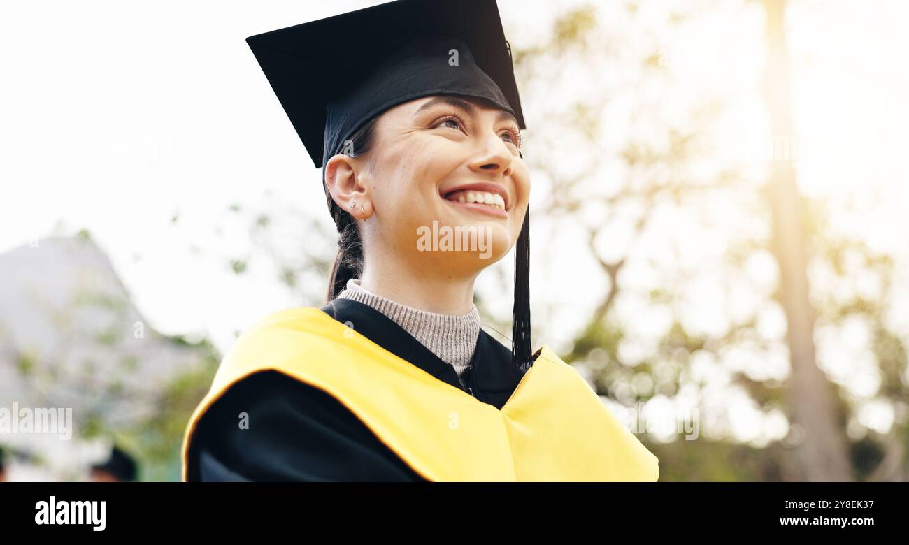 Outdoor, woman and smile for graduation at university with pride and ...