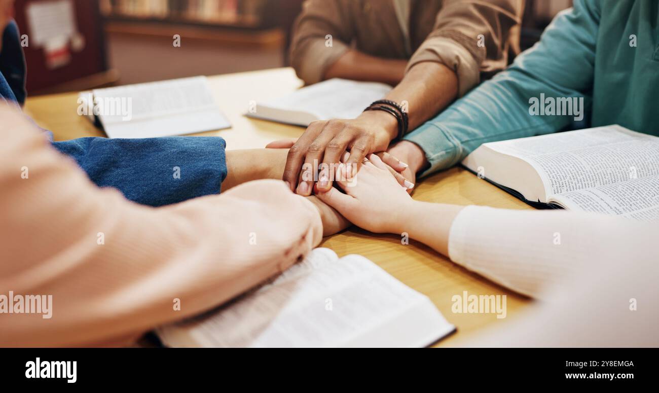 Table, holding hands and group with faith, praying and friends with ...