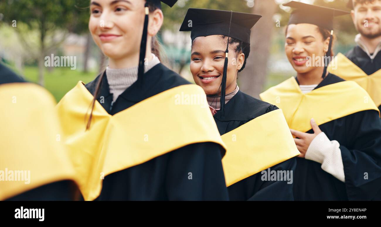 Row, graduation and students outdoor at university for achievement in ...
