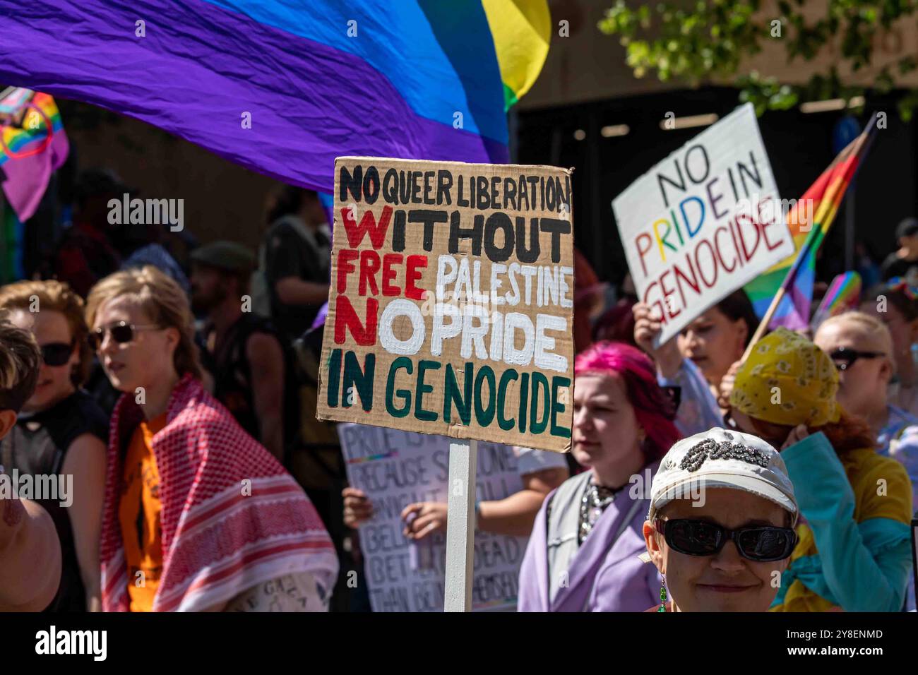 Pro-Palestinian protesters with handmade cardboard signs at Helsinki ...