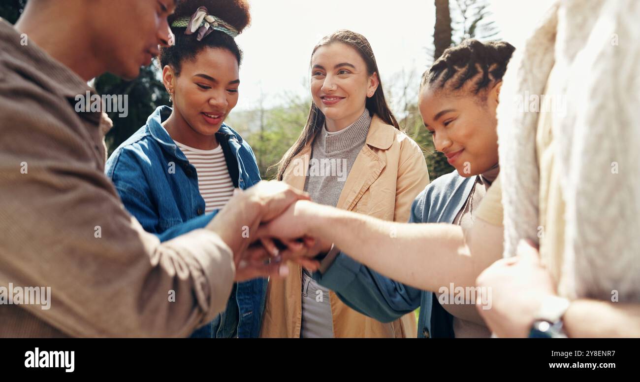 Students, smile and hands stack for teamwork outdoor with education ...