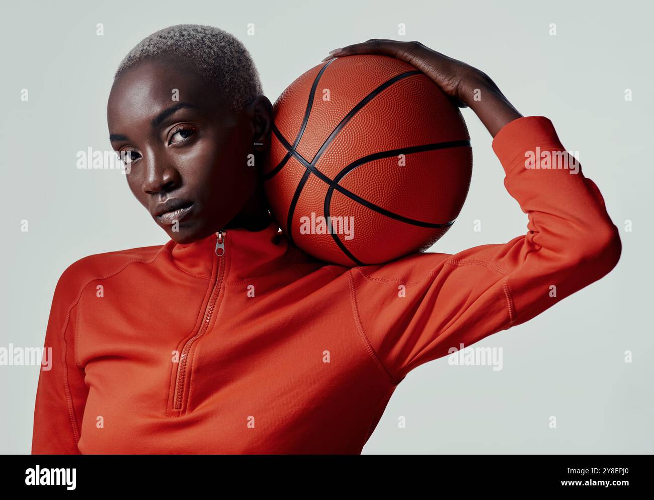 Serious, black woman and portrait with basketball in studio, balance ...