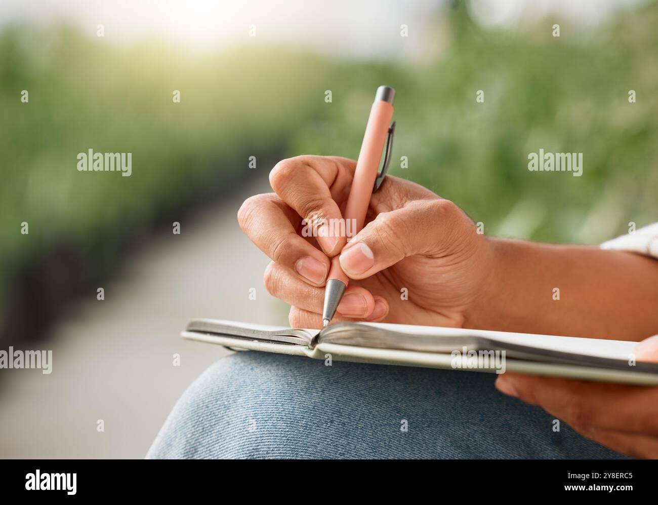 Greenhouse, farming and hands of person for writing, information and ...