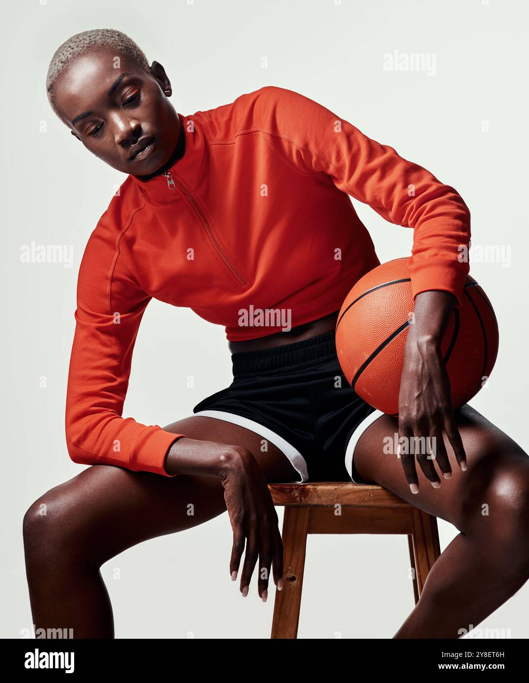 Black woman, basketball and sports in studio for fitness with thinking ...