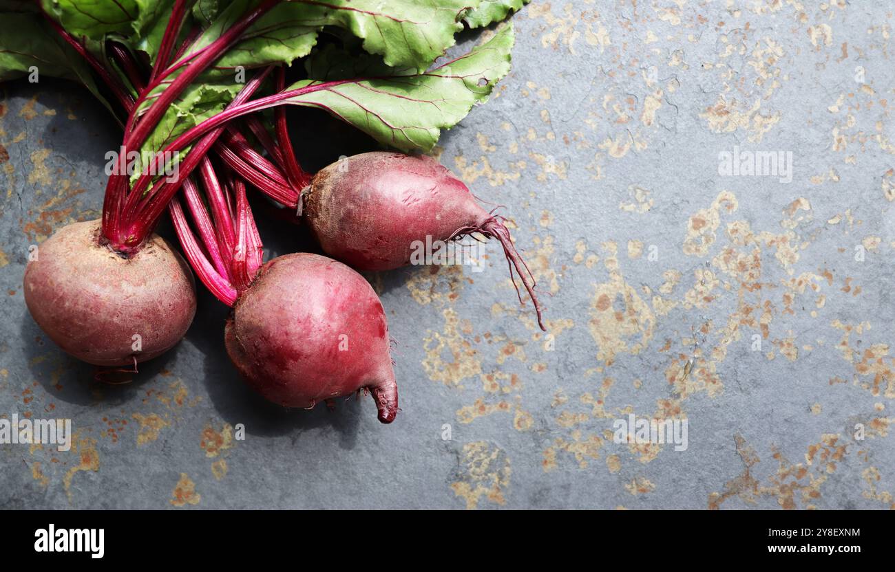 Fresh beetroot with leaves on a blue background. Healthy food. Top view ...