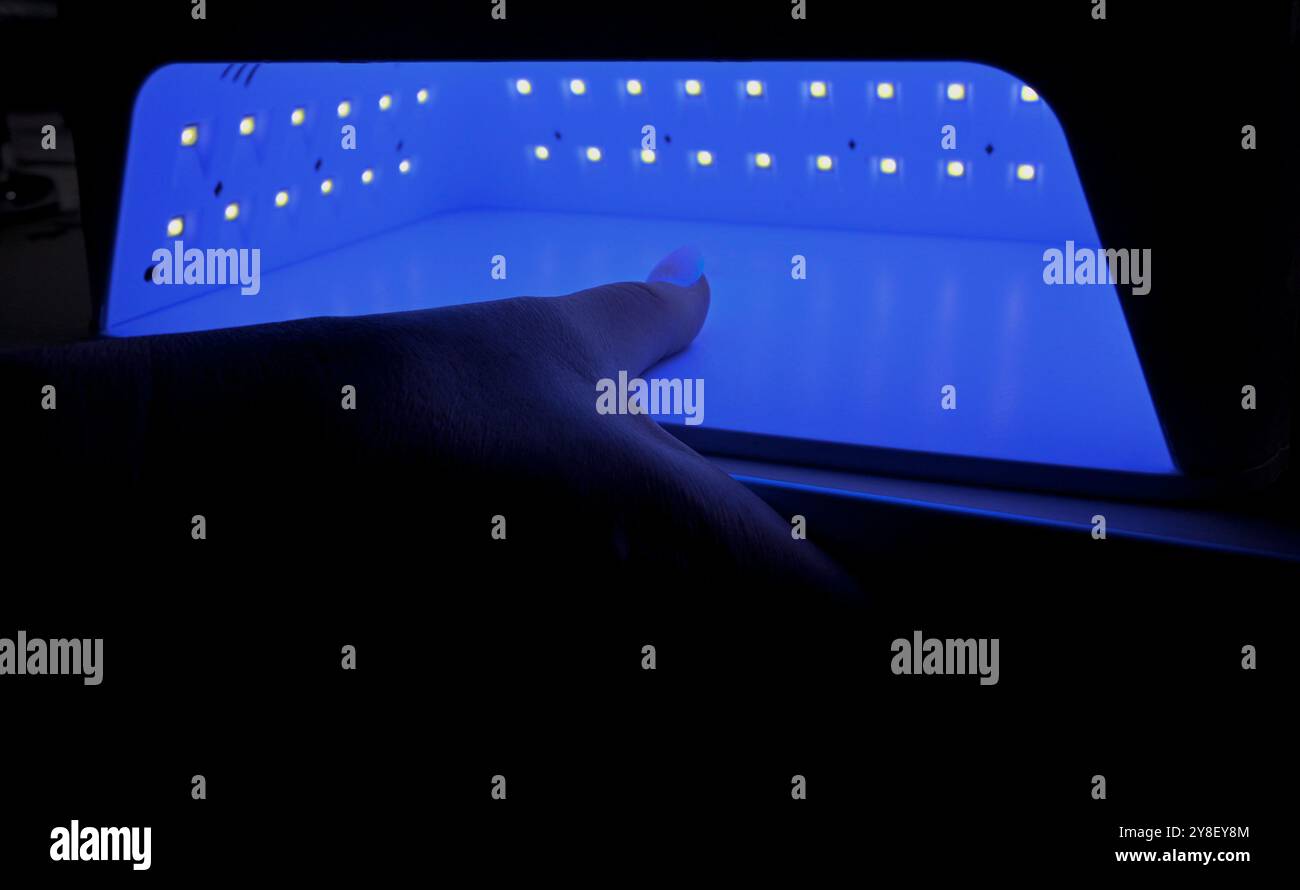 Uv lamp curing nails under hi-res stock photography and images - Alamy