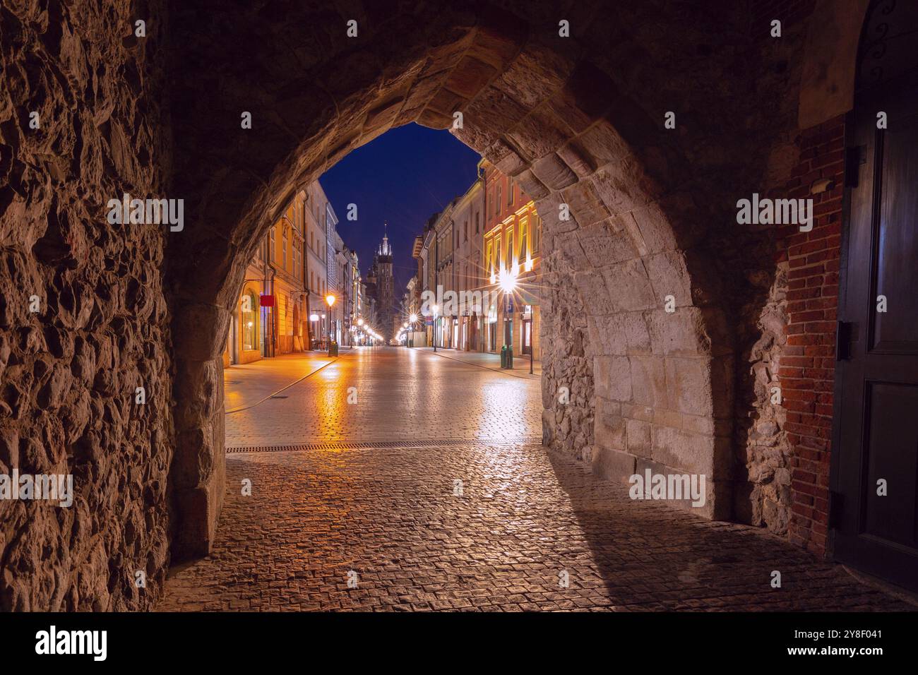 View through Florianska Gate in Krakow, Poland, showing the cobblestone ...