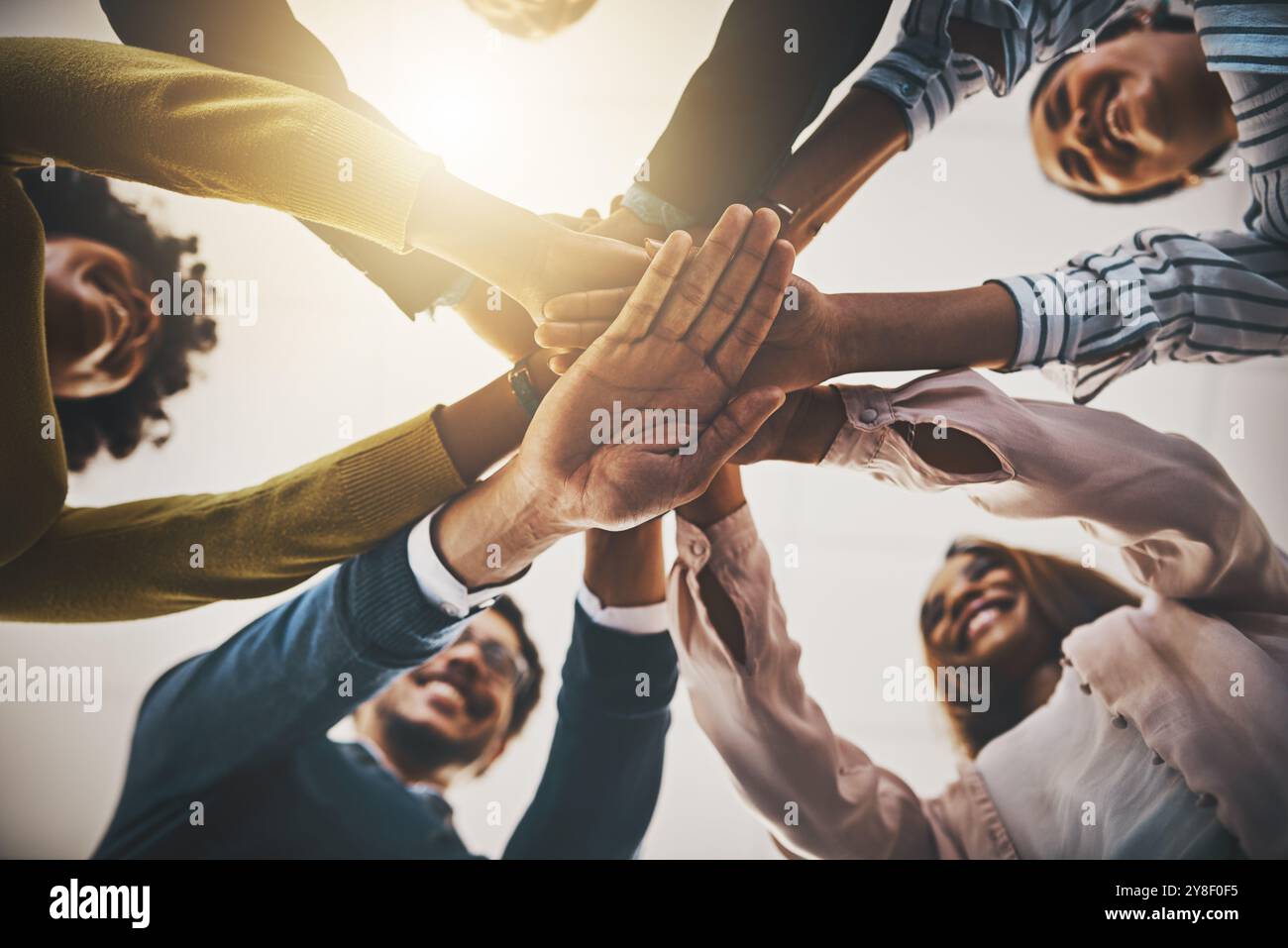 Stack hands, team building and happy business people with support, synergy and cooperation ...