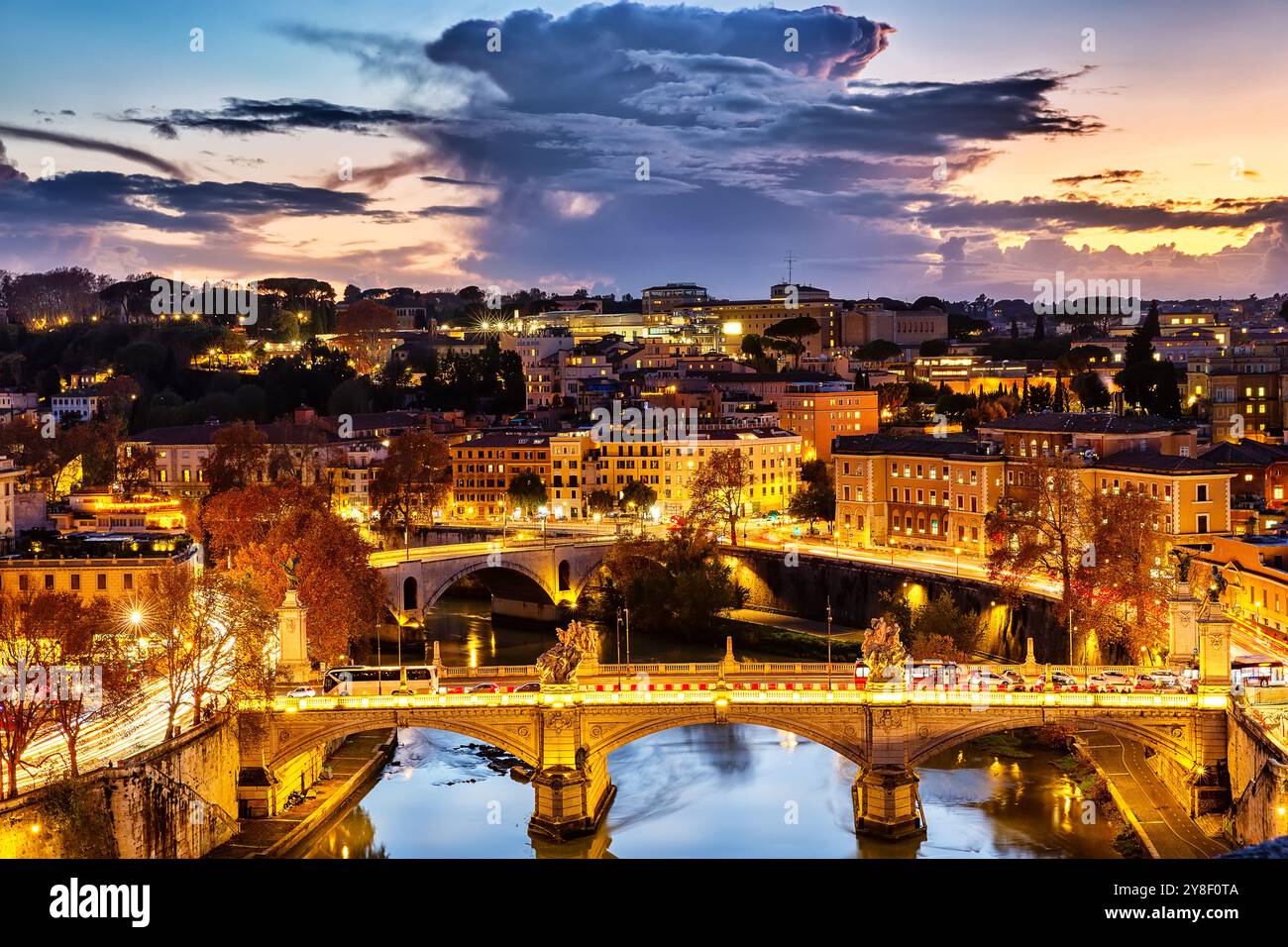 Aerial view of Rome city at night, Italy. Top view of Ponte Vittorio ...