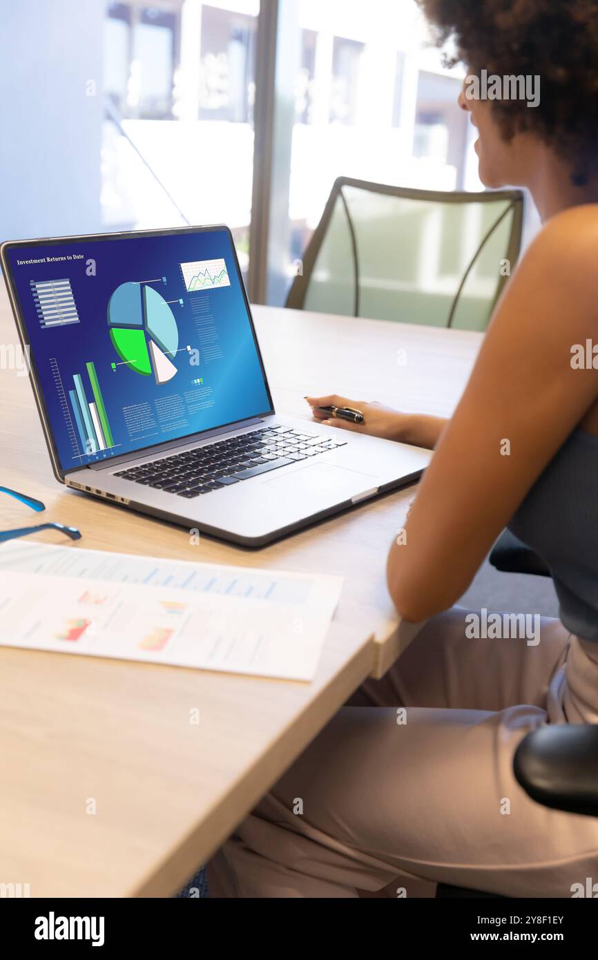 Vertical biracial businesswoman using hi-res stock photography and ...