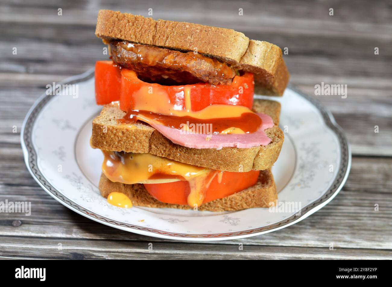 multilayer whole wheat brown toast filled with fried beef burger cooked ...