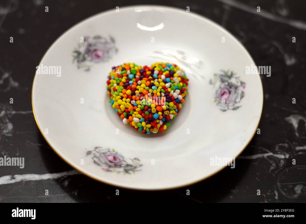 sweet taffy dessert coated with candy coated rainbow chips, a sweet ...