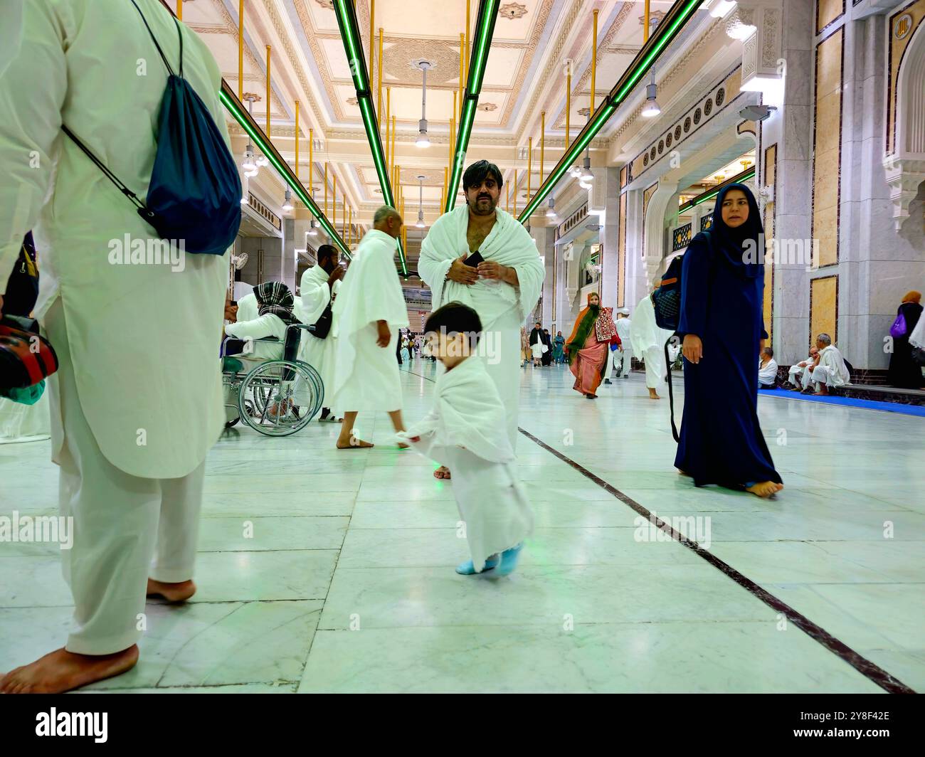 Mecca, Saudi Arabia, June 8 2024: A young pilgrim child with the ...
