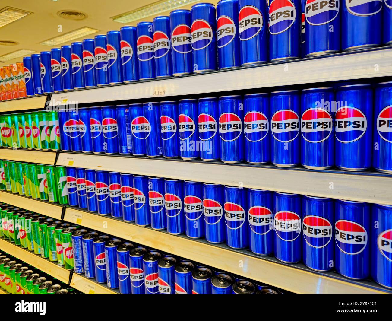 Cairo, Egypt, September 13 2024: Pepsi, Cola flavor cans on shelves, a ...
