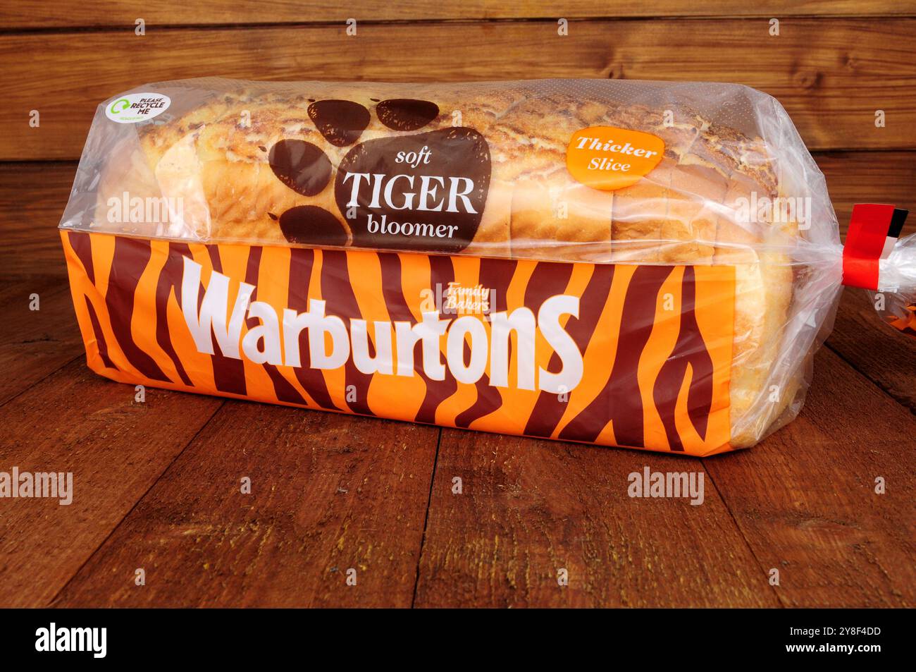 Warburtons thick sliced soft tiger bloomer bread loaf with a wood ...